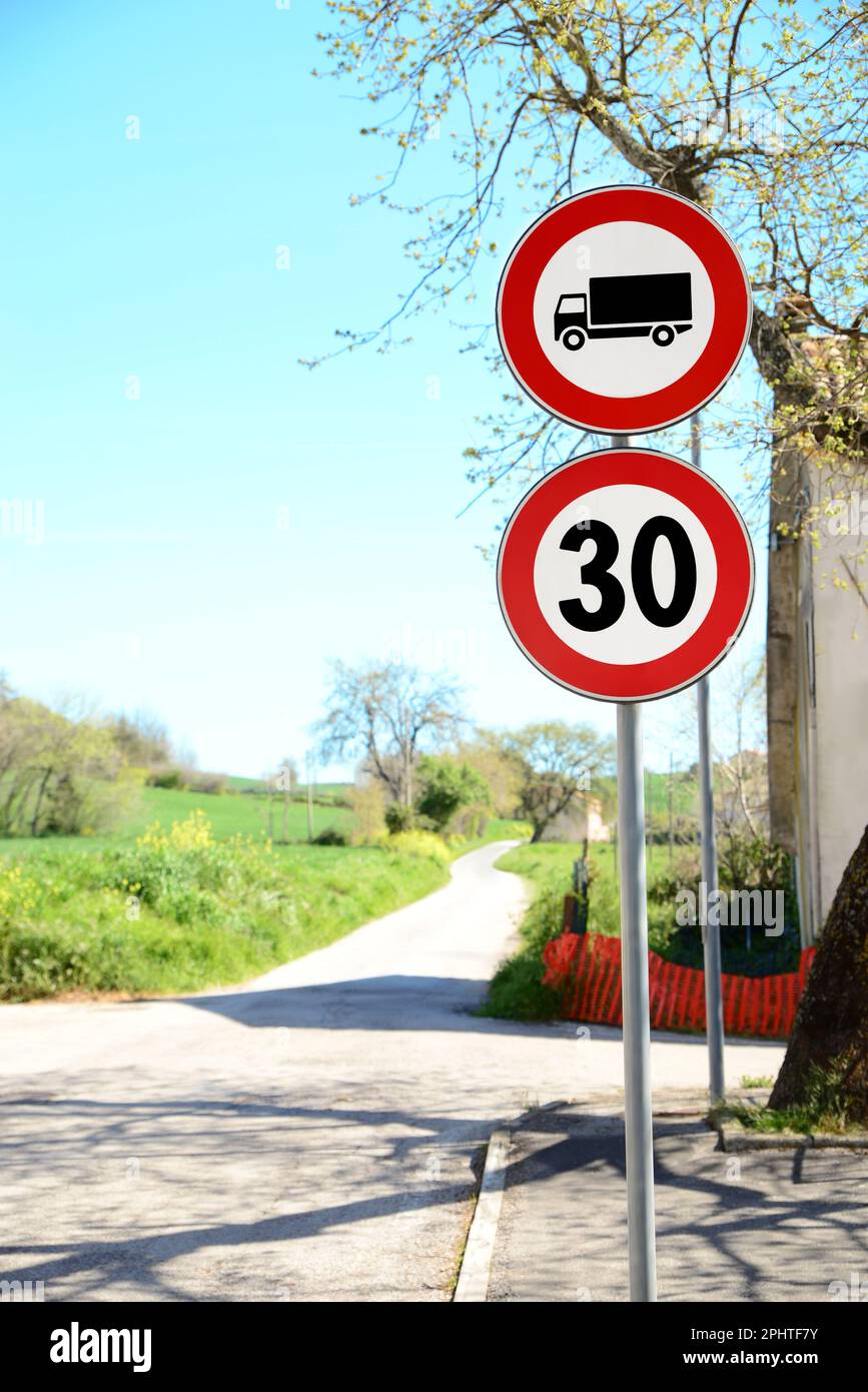 Road signs Maximum Speed 30 and No Truck on city street Stock Photo - Alamy