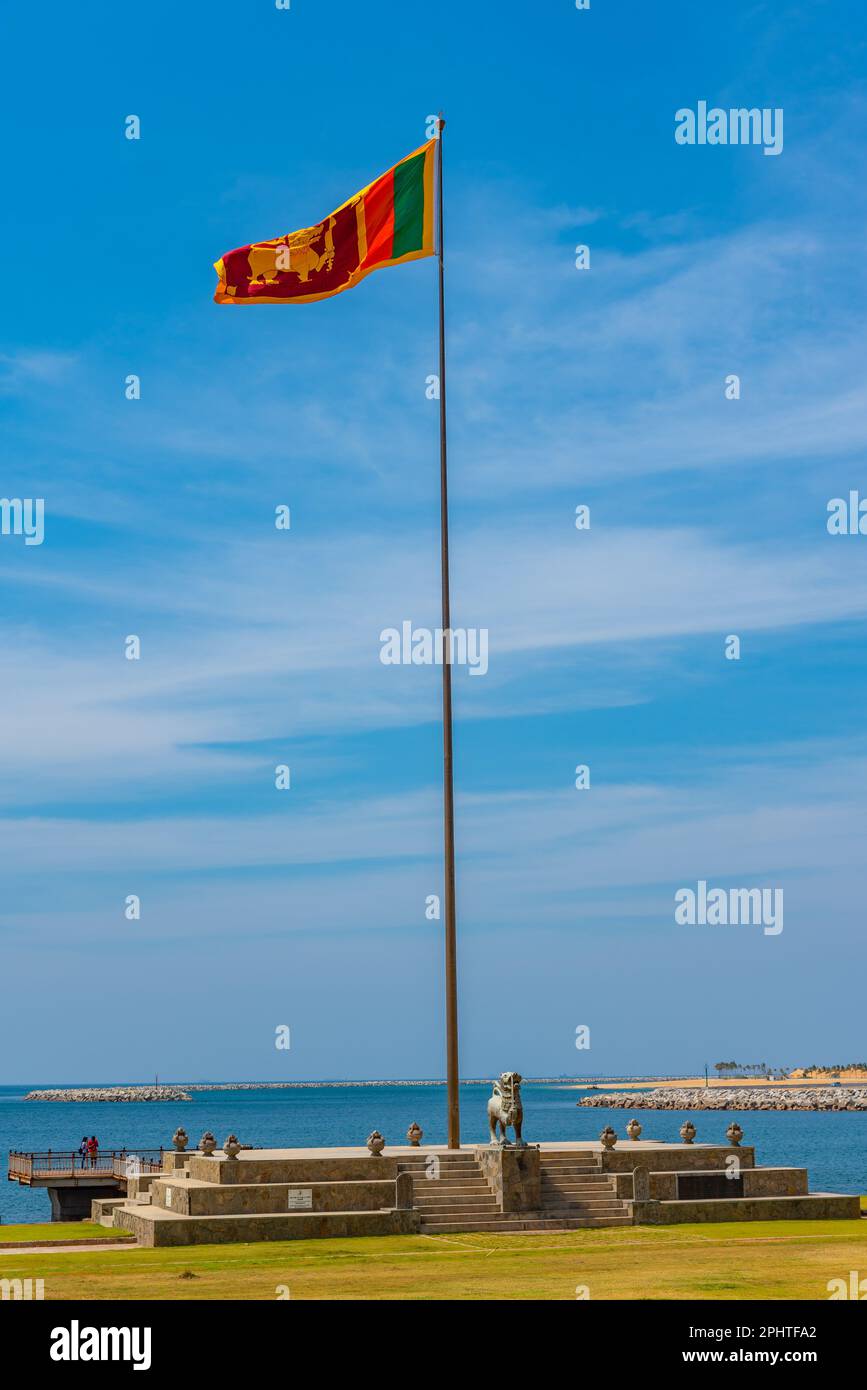 Flagpole with Sri Lankan flag waving over Galle Face Green park at ...