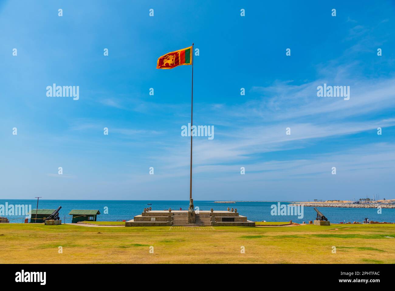 Flagpole with Sri Lankan flag waving over Galle Face Green park at ...