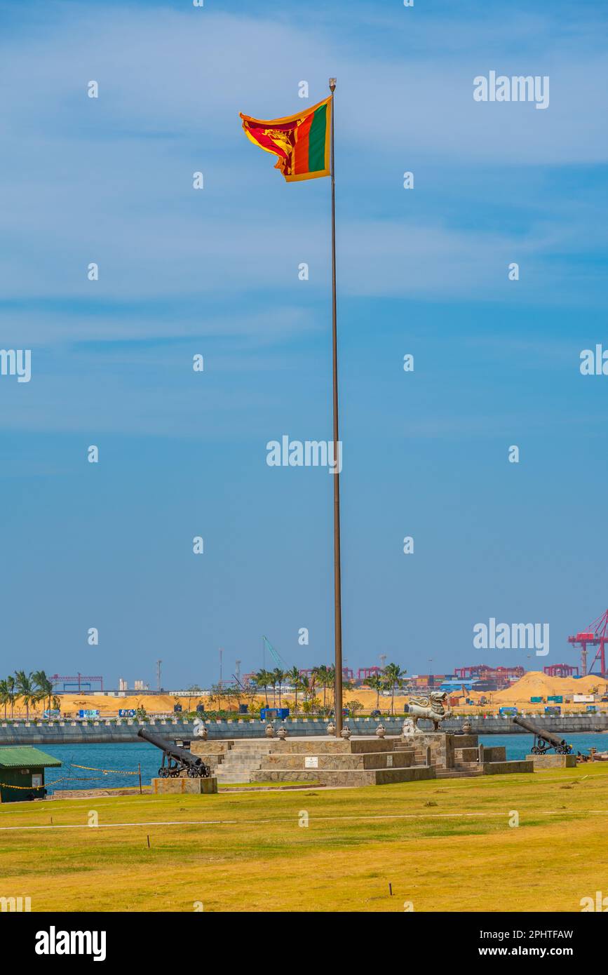 Flagpole with Sri Lankan flag waving over Galle Face Green park at ...