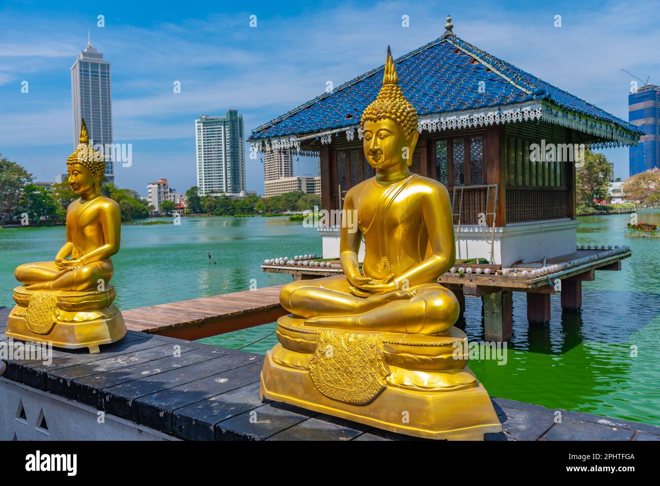 Golden buddha statues at Gangarama Seema Malakaya buddhist temple at ...