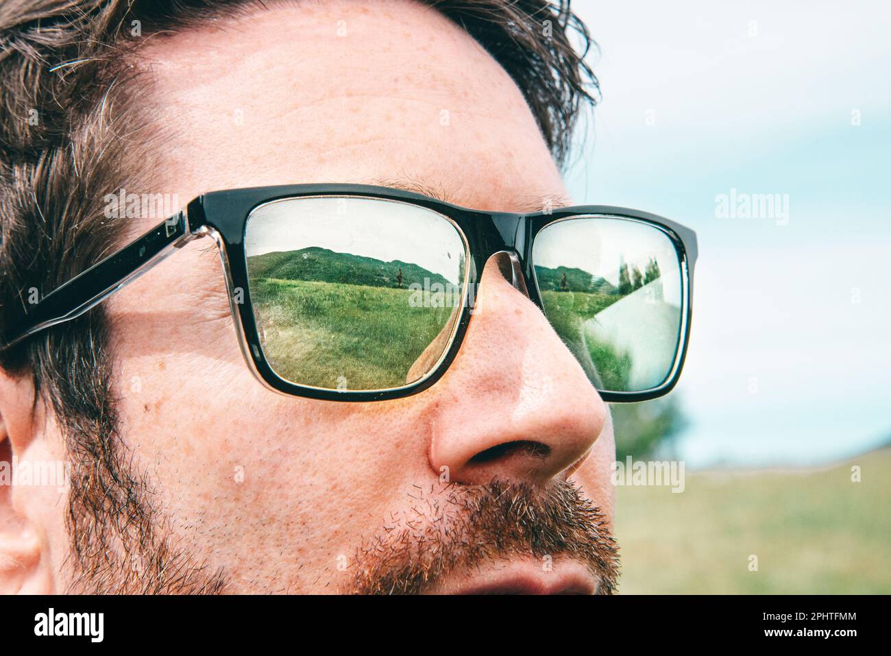Green field reflecting in a man sun glasses Stock Photo - Alamy