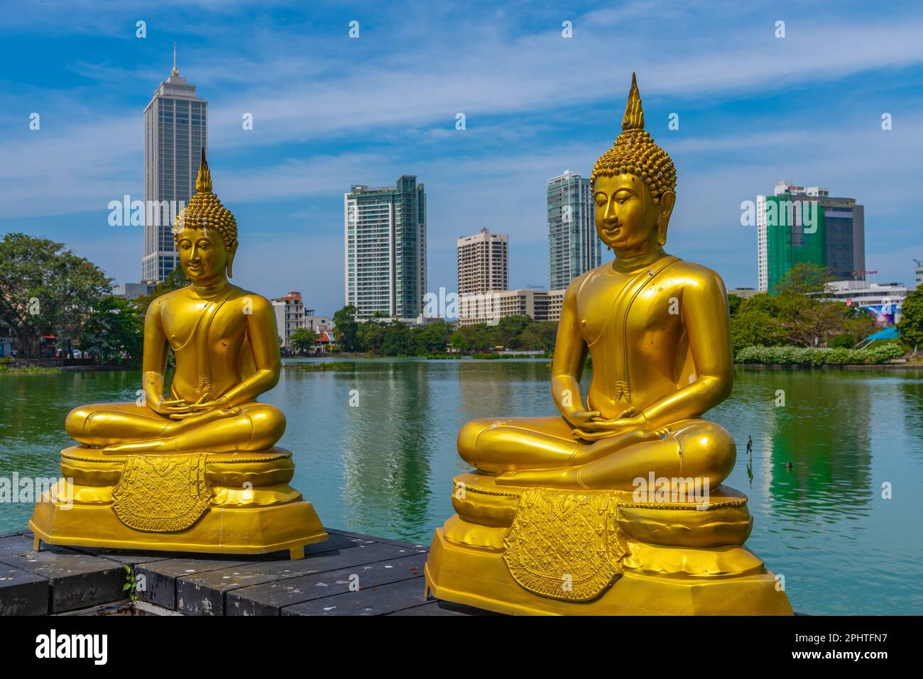 Golden buddha statues at Gangarama Seema Malakaya buddhist temple at ...