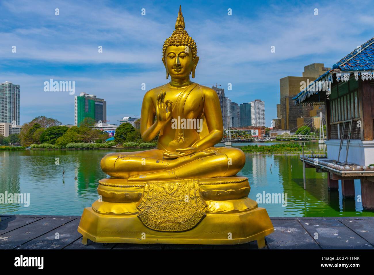 Golden buddha statues at Gangarama Seema Malakaya buddhist temple at ...