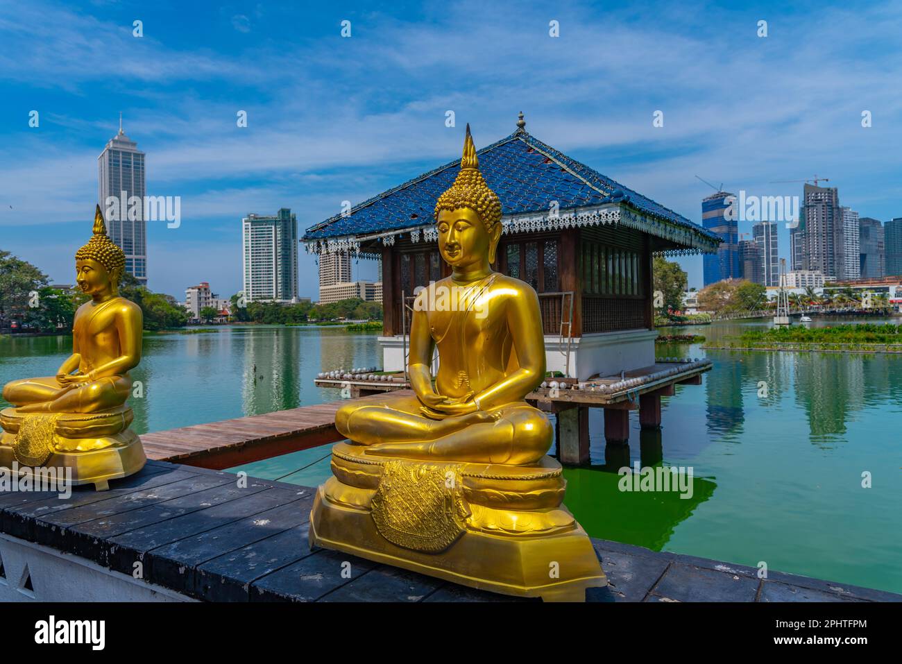 Golden buddha statues at Gangarama Seema Malakaya buddhist temple at ...