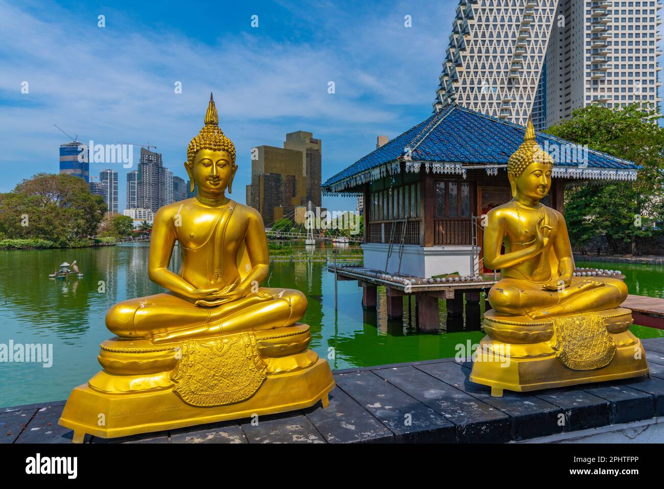Golden buddha statues at Gangarama Seema Malakaya buddhist temple at ...