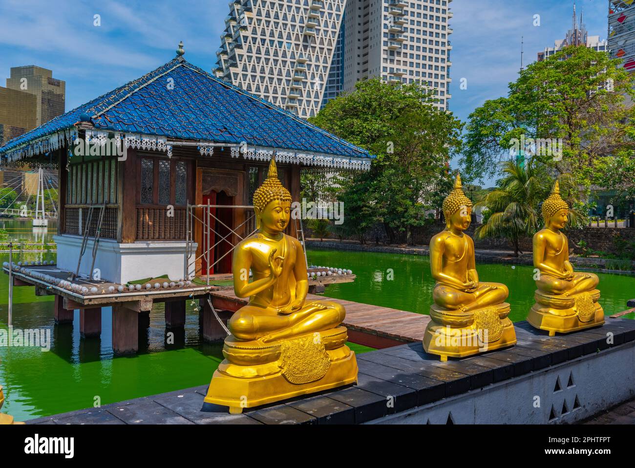 Golden buddha statues at Gangarama Seema Malakaya buddhist temple at ...