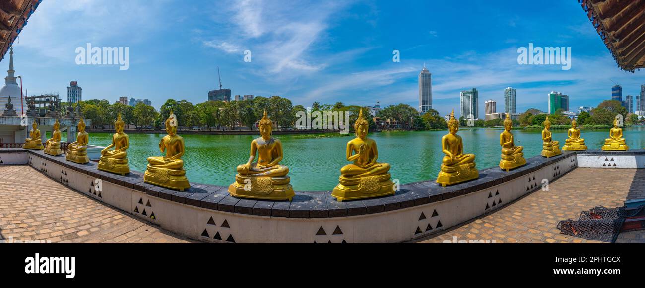 Buddha statues at seema malaka temple with colombo skyline hi-res stock ...