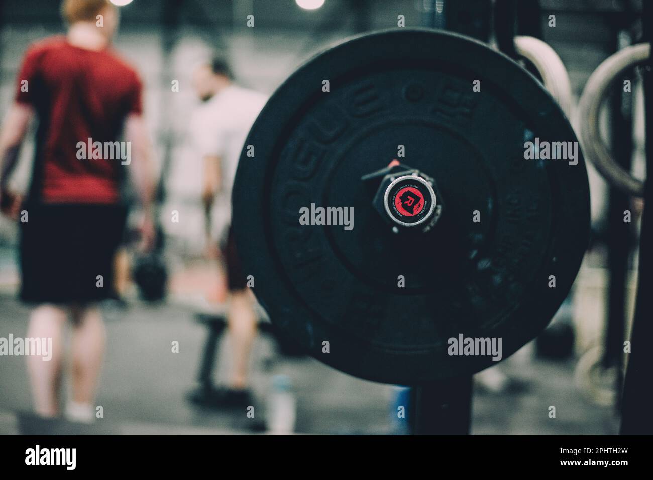 side view of barbell weight lifting exercise in a crossfit gym ...