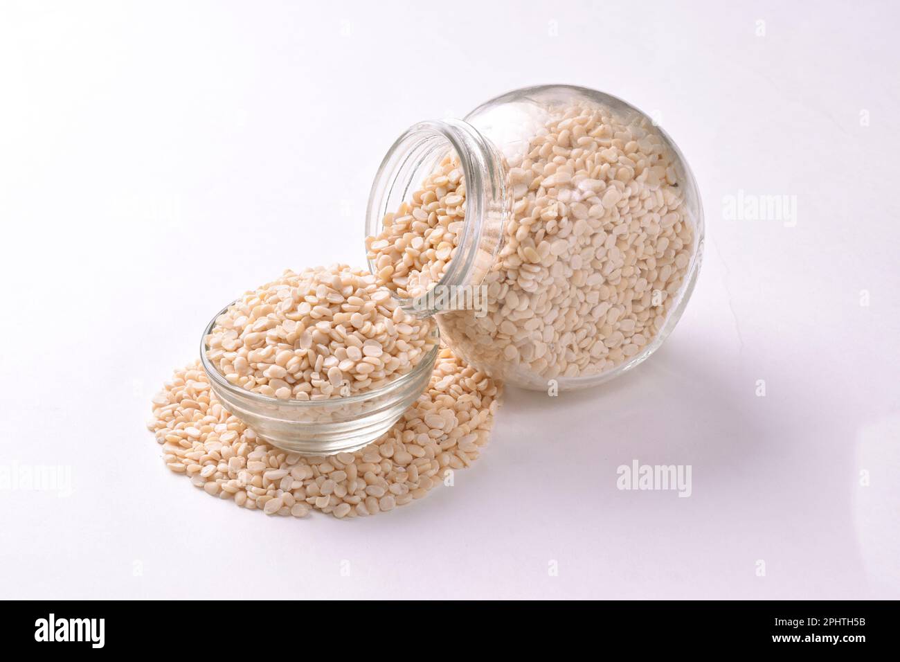 Raw white urad gram isolated on white background Stock Photo - Alamy