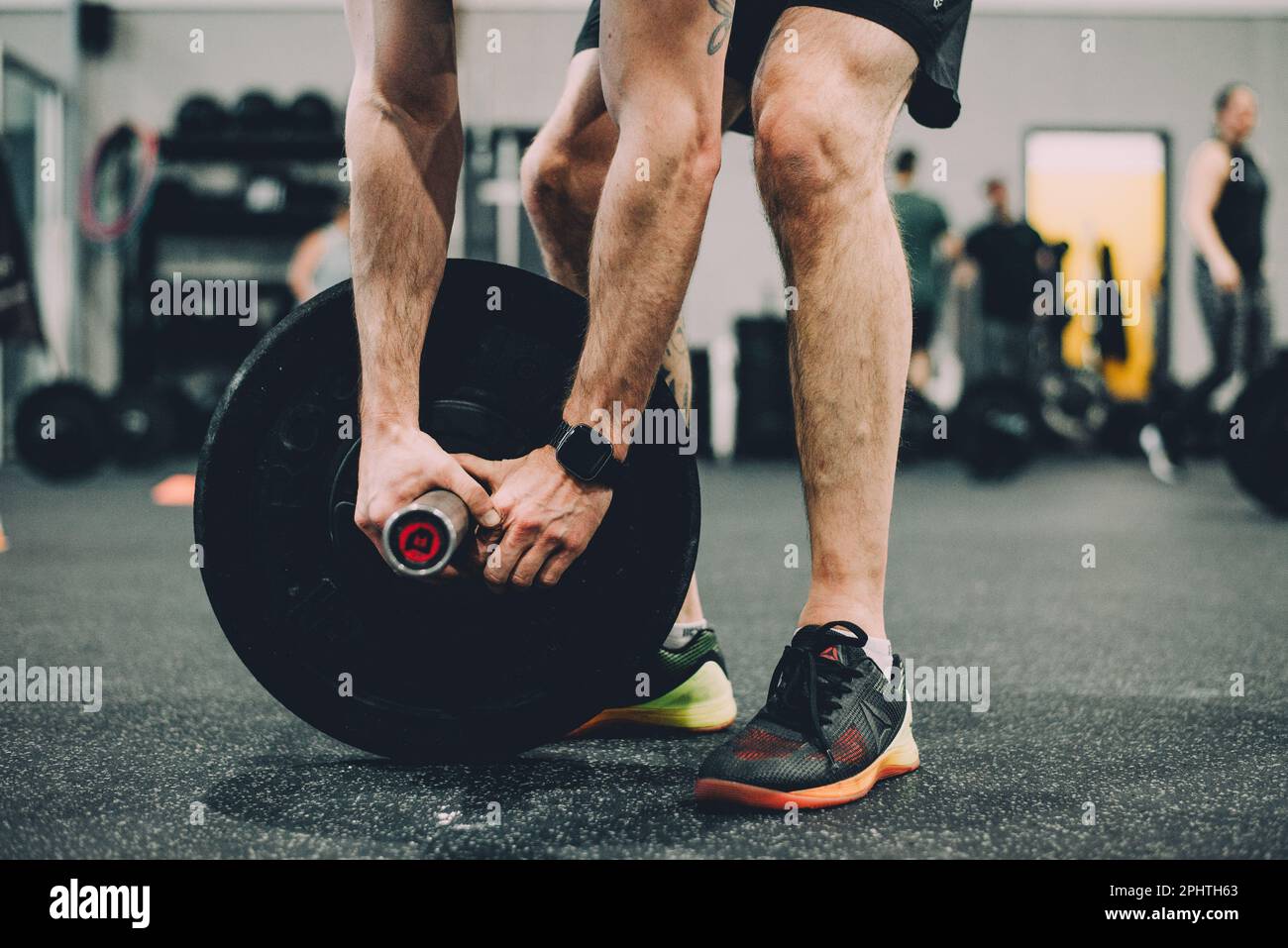 A man lifting hi-res stock photography and images - Alamy
