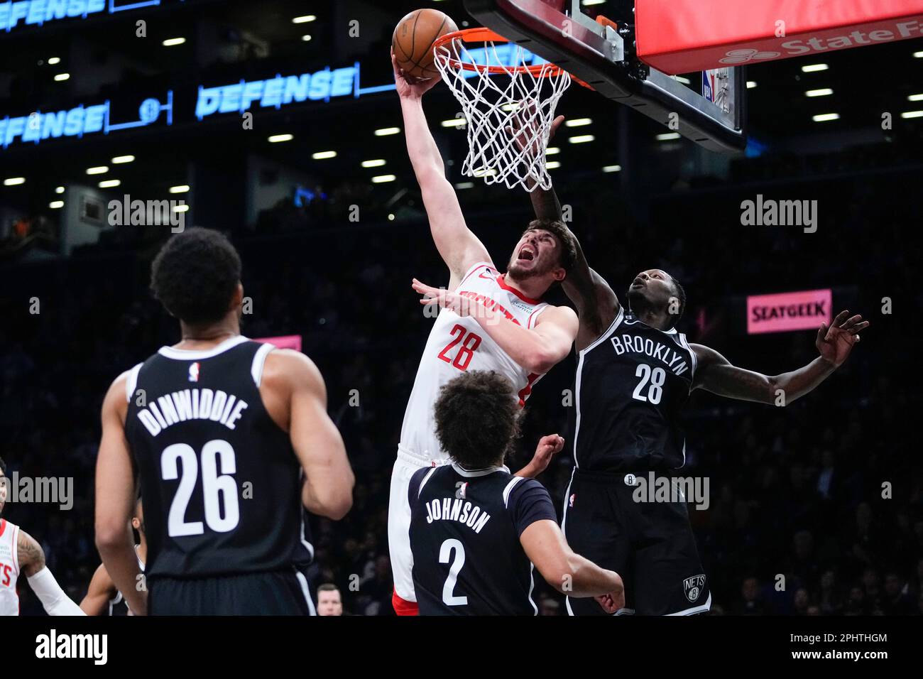 Houston Rockets' Alperen Sengun (28) dunks the ball in front of ...