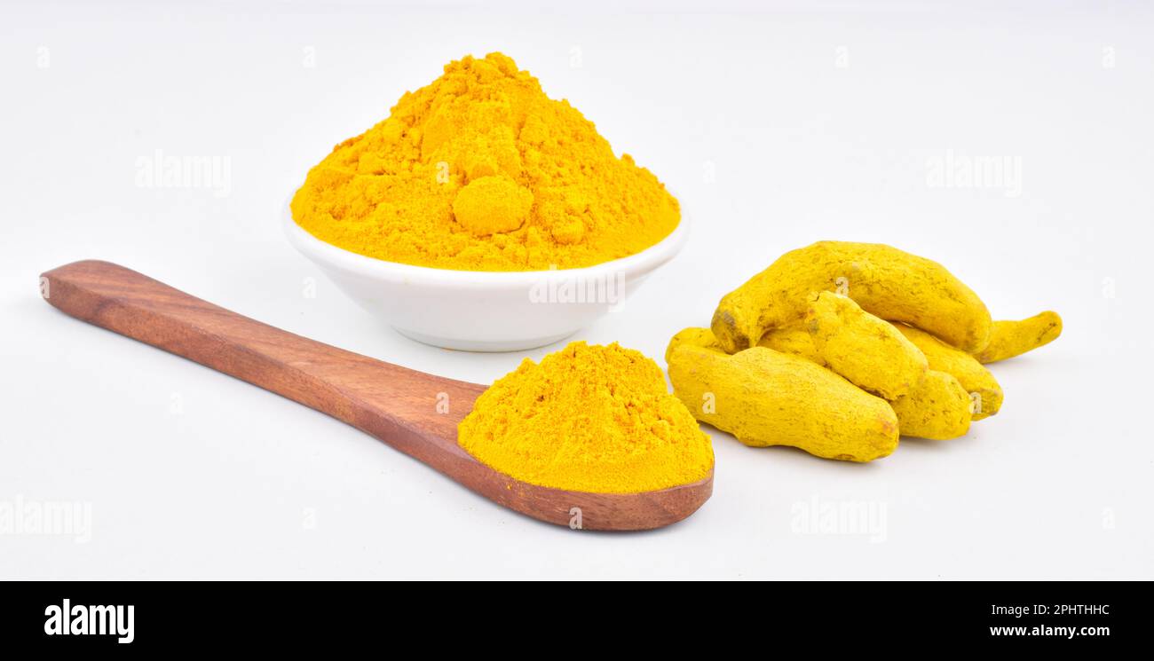 Raw turmeric with powder isolated on white background Stock Photo - Alamy