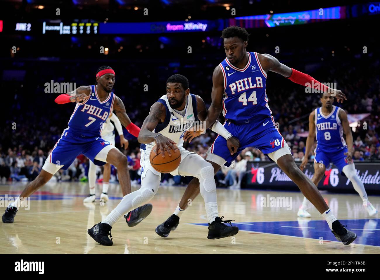 Dallas Mavericks' Kyrie Irving, center, tries to get past Philadelphia ...