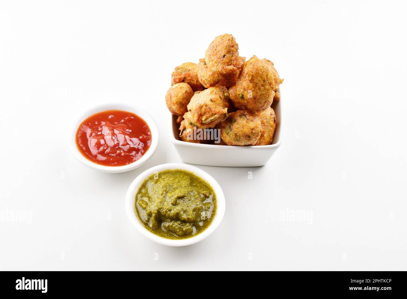 Dal pakoda with chutney isolated on white background Stock Photo - Alamy