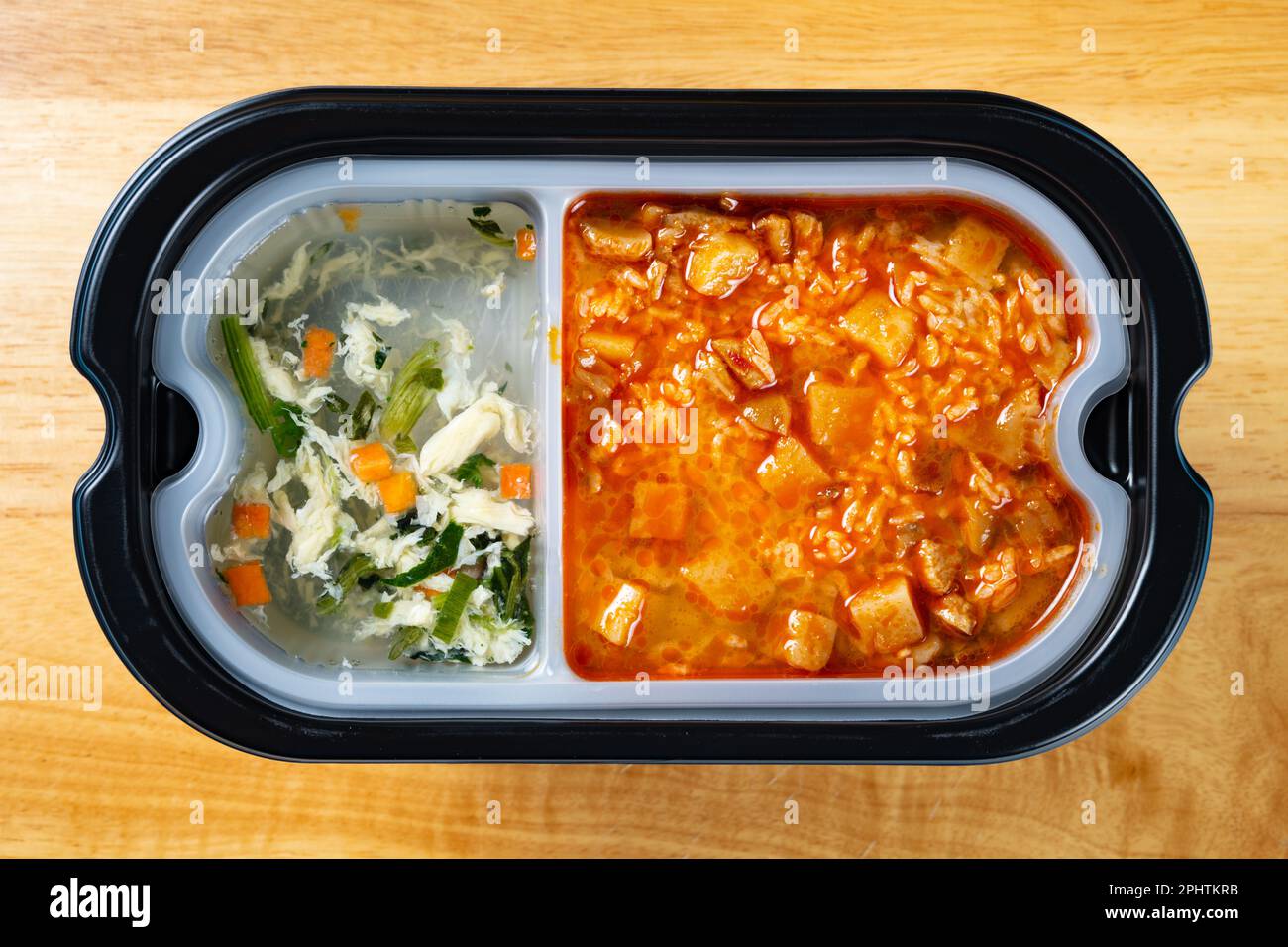 top view self-cooking uncook stewed chicken with rice and soup Stock ...