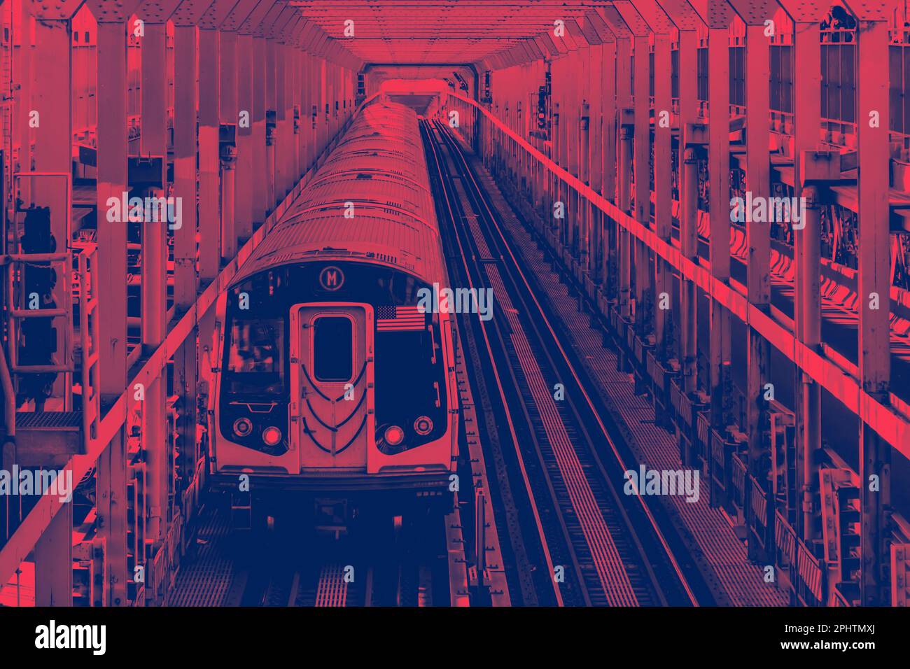 Subway train traveling on tracks across the Williamsburg Bridge from Brooklyn to Manhattan in ...