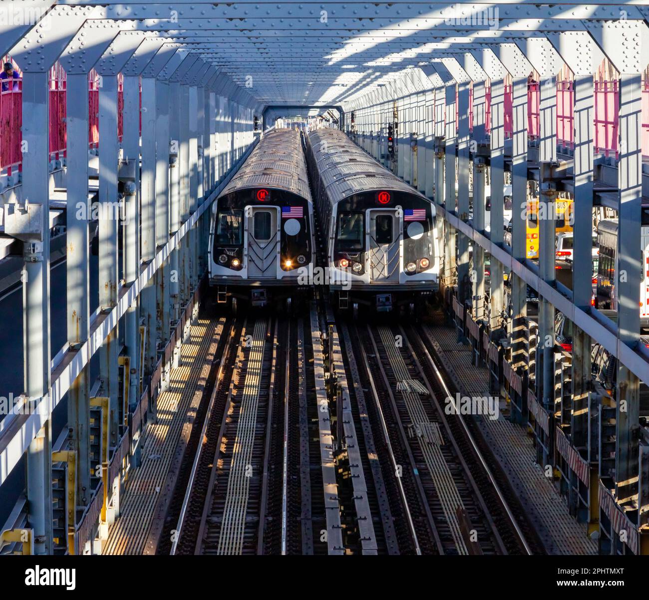 Subway cars passing each other on the Williamsburg Bridge from Brooklyn to Manhattan in New York ...