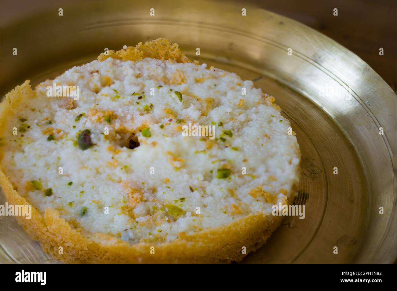 Ghewar or ghevar is a traditional sweet of rajasthan. It is made of ...