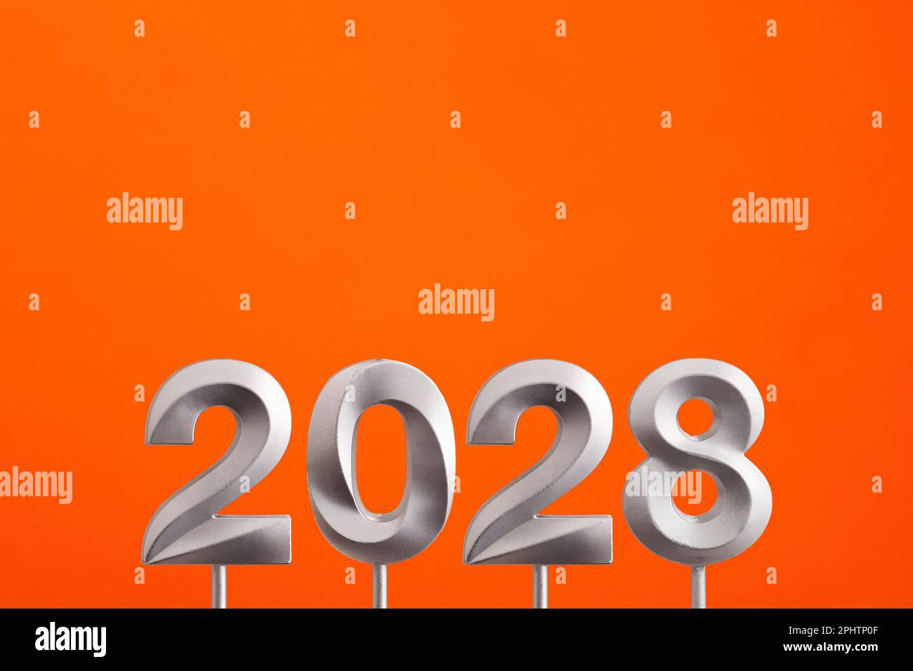 Year 2028 - Silver number on orange foamy background Stock Photo - Alamy
