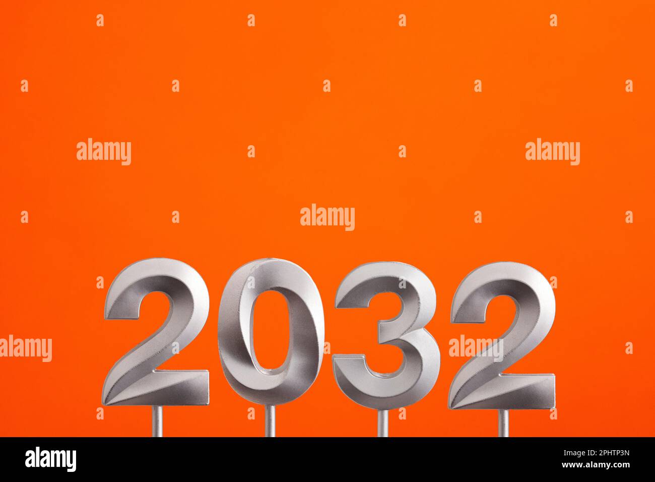 Year 2032 - Silver number on orange foamy background Stock Photo - Alamy