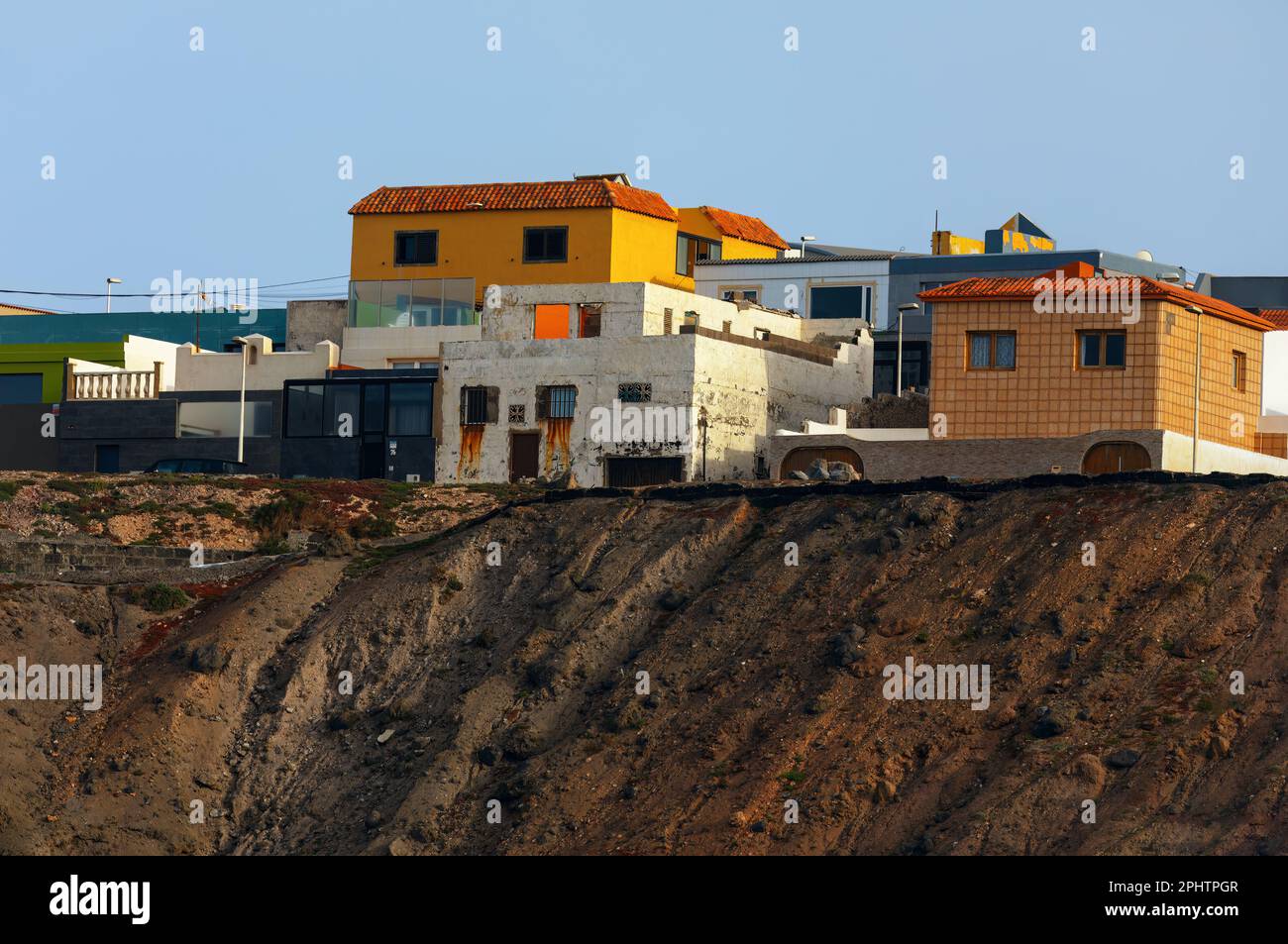 Houses situated at the cliff edge . Dangerous landslide for buildings ...
