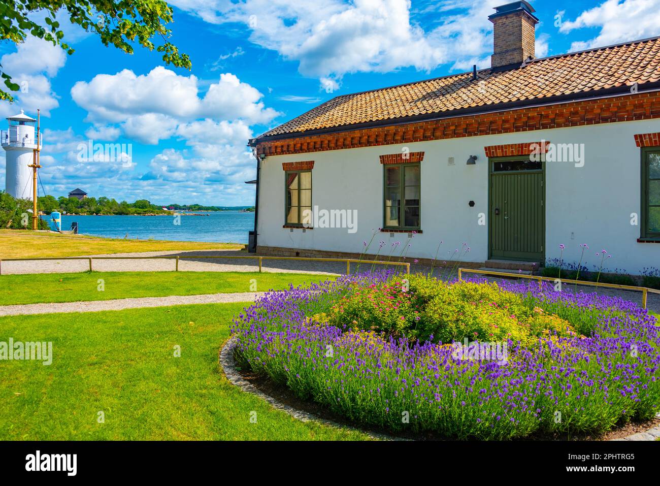 Lighthouse at traditional port buildings in Karlshamn, Sweden Stock ...