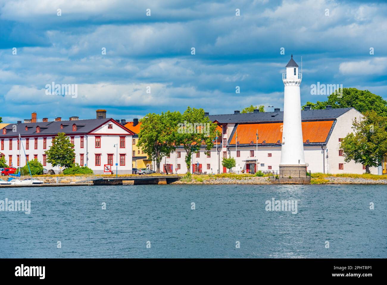 Lighthouse at traditional port buildings in Karlshamn, Sweden Stock ...