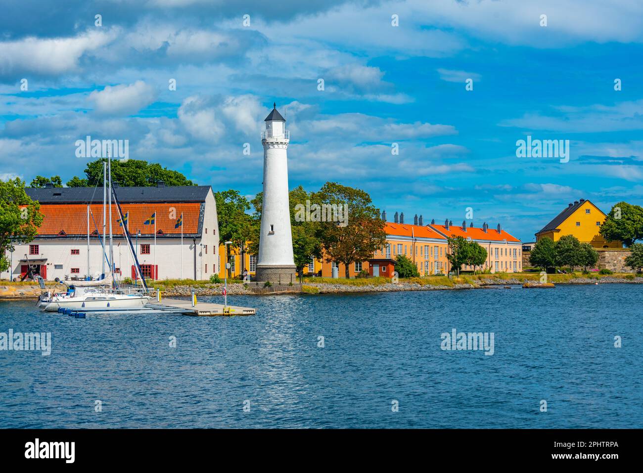 Lighthouse at traditional port buildings in Karlshamn, Sweden Stock ...