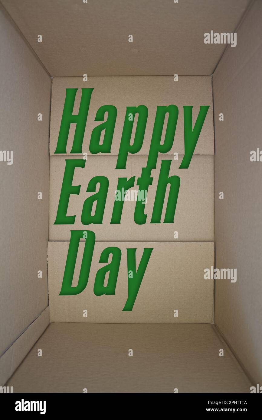 Earth Day word with cardboard box. Brown folded card box Stock Photo ...