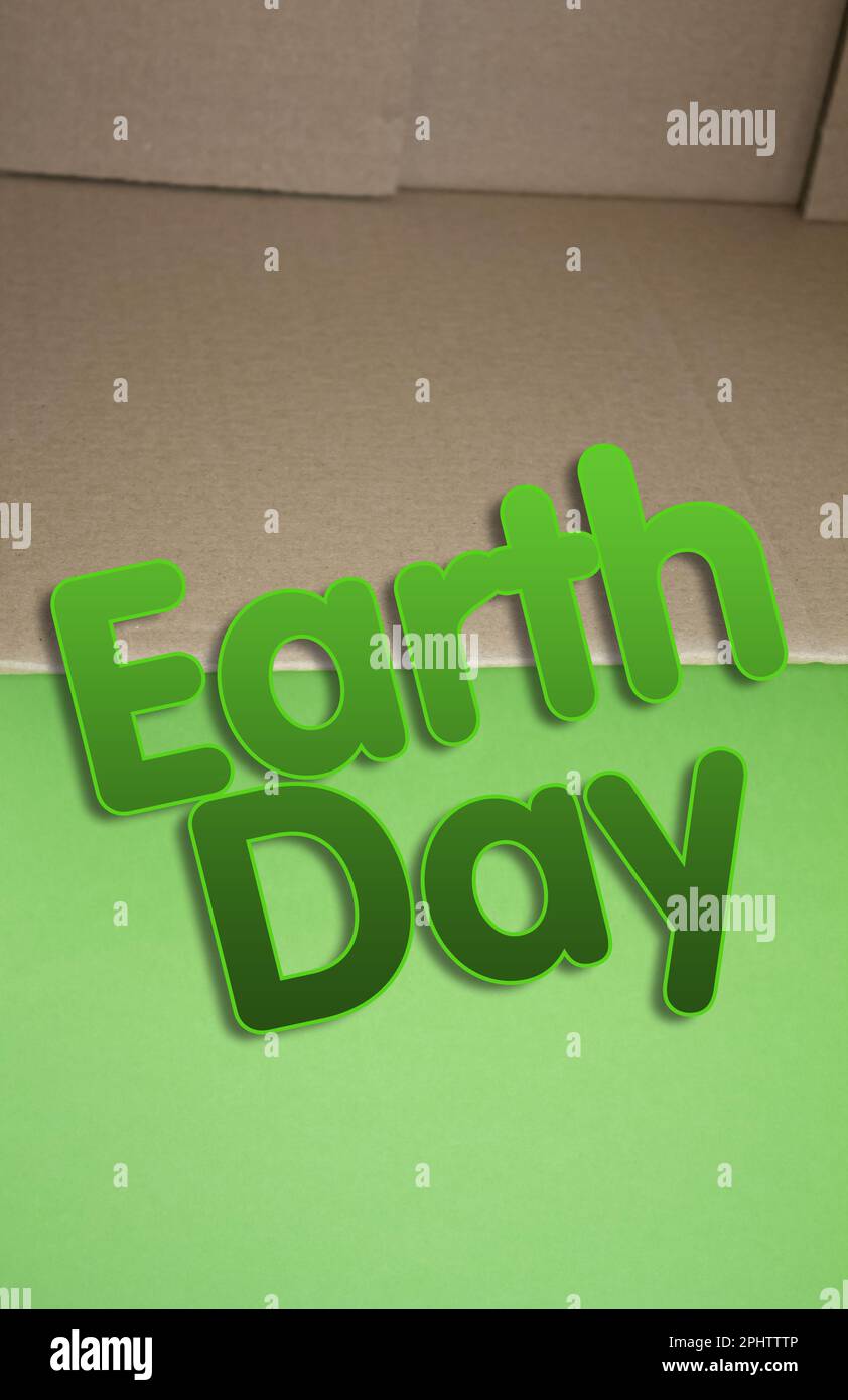 Earth Day word with cardboard box. Brown folded card box Stock Photo ...