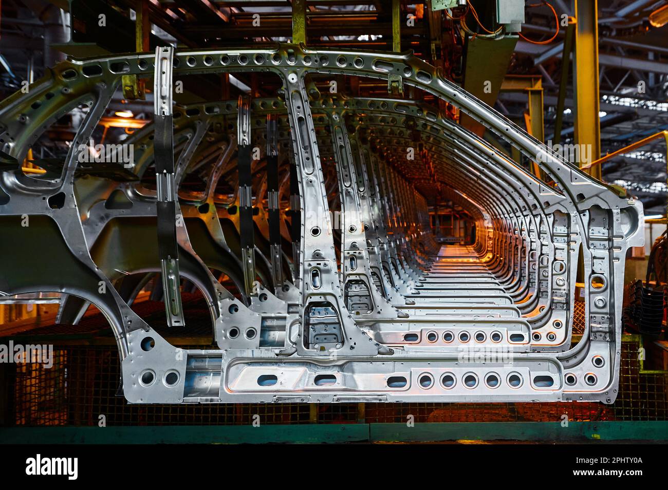 Passenger car carcass parts on assembling conveyor at plant Stock Photo - Alamy