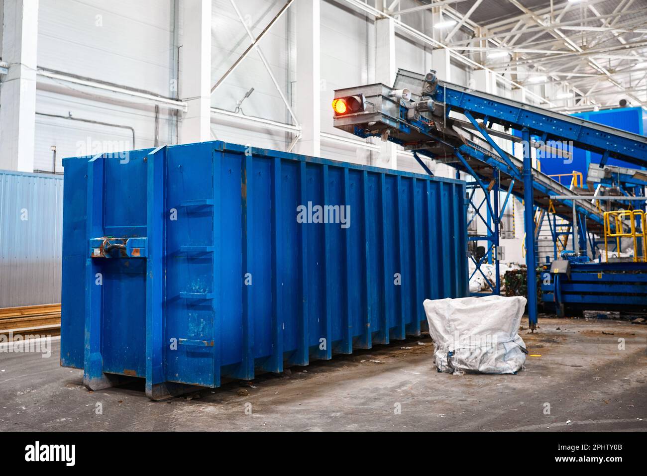 Large container and belt conveyors transporting garbage Stock Photo - Alamy