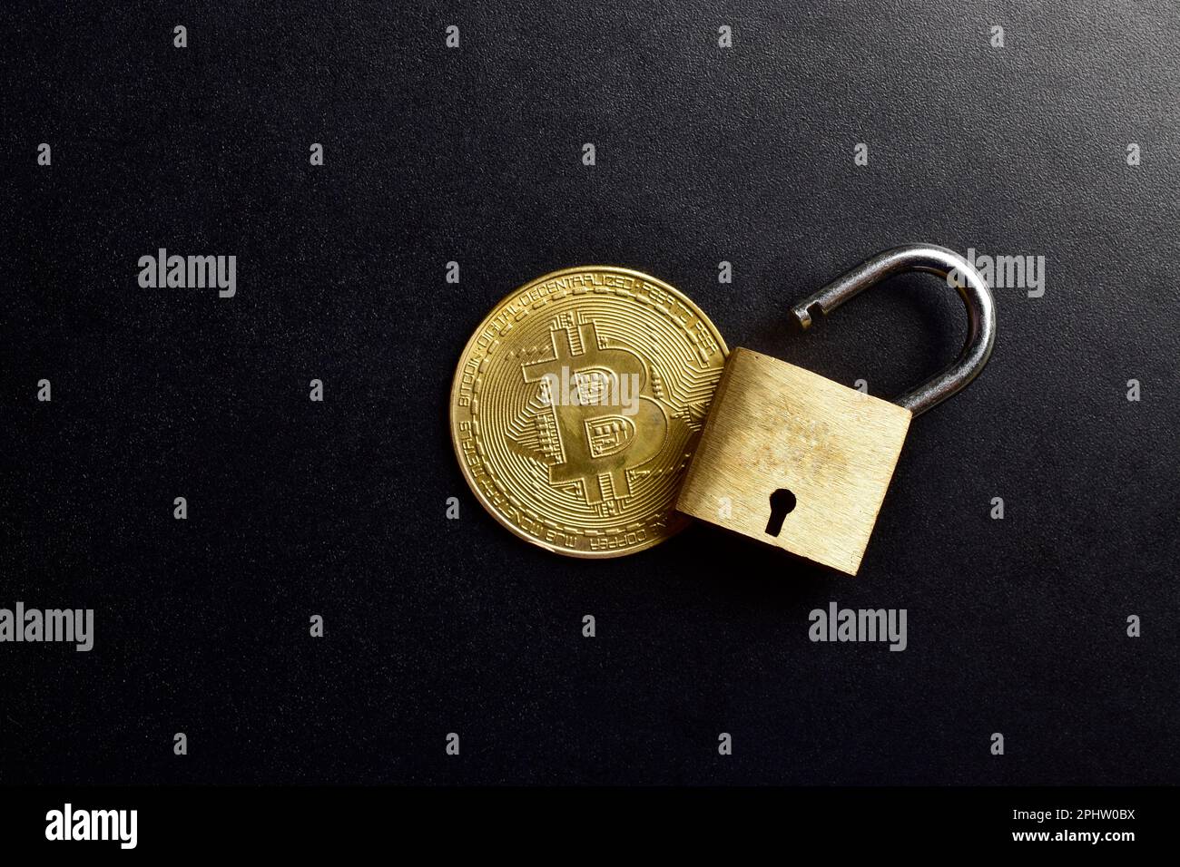 Top view of unlocked lock on black background Stock Photo - Alamy