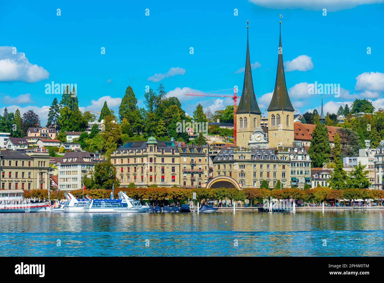 Waterfront of lake Lucerne with a church in Luzern, Switzerland Stock ...