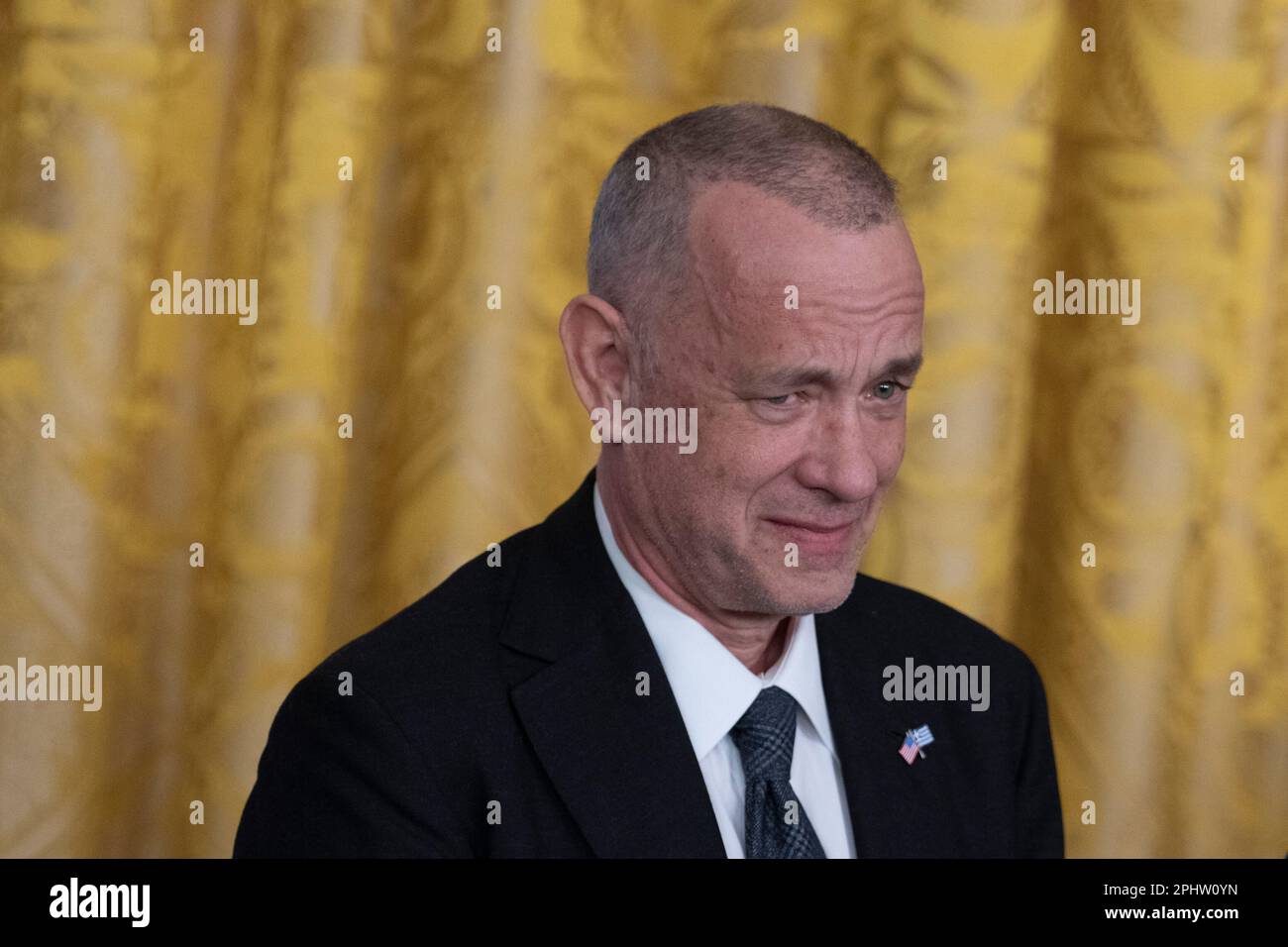 Washington, DC. 29th Mar, 2023. Actor Tom Hanks takes the stage after ...