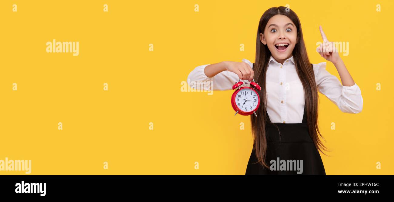 inspired with idea child with alarm clock. school kid in uniform ...