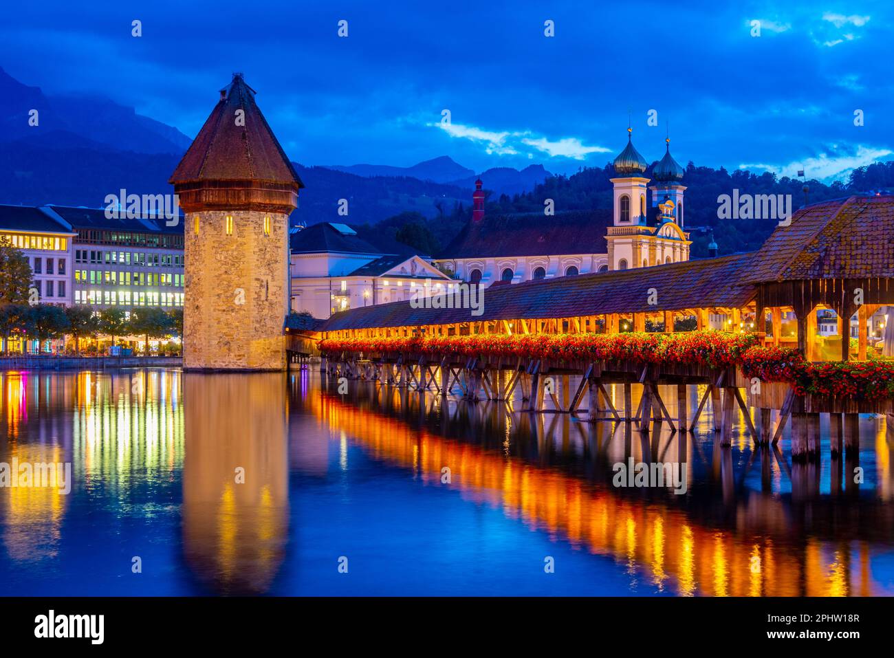 Night view of Kapellbruecke with Francis Xavier church at Swiss town ...
