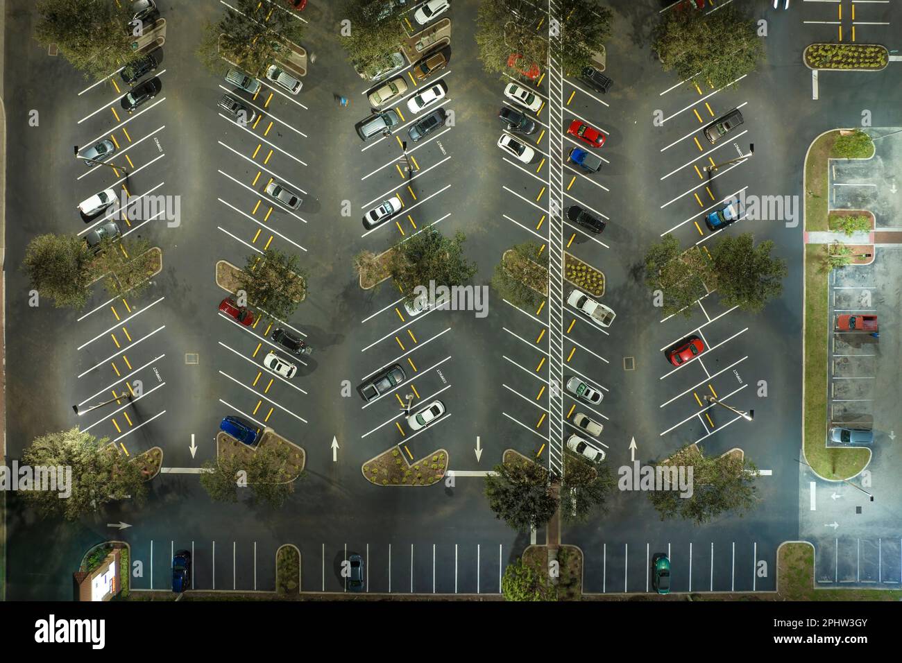 Aerial night view of many cars parked on parking lot with lines and ...