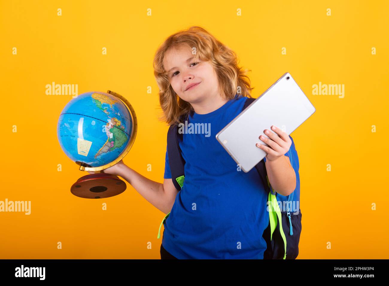 School boy world globe and tablet. Nerd school kid isolated on studio ...