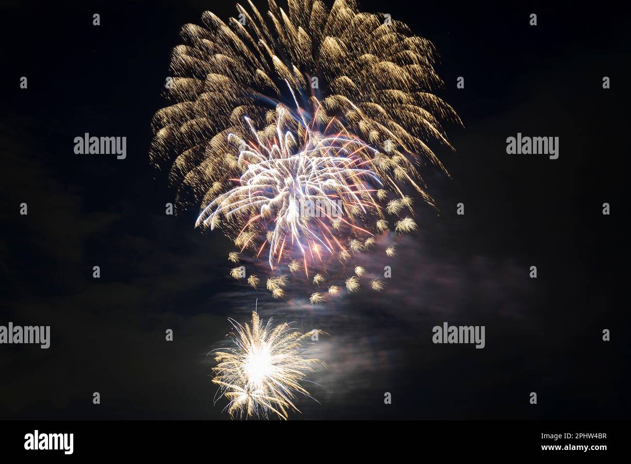 Aerial view of bright fireworks exploding with colorful lights against ...