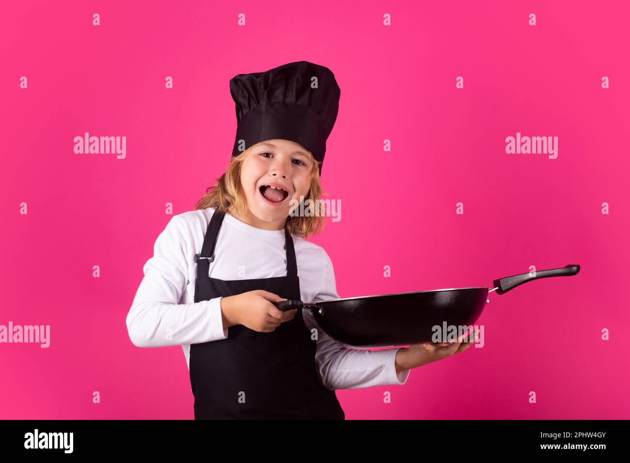 Child chef cook with pan. Kid chef cook prepares food on isolated ...