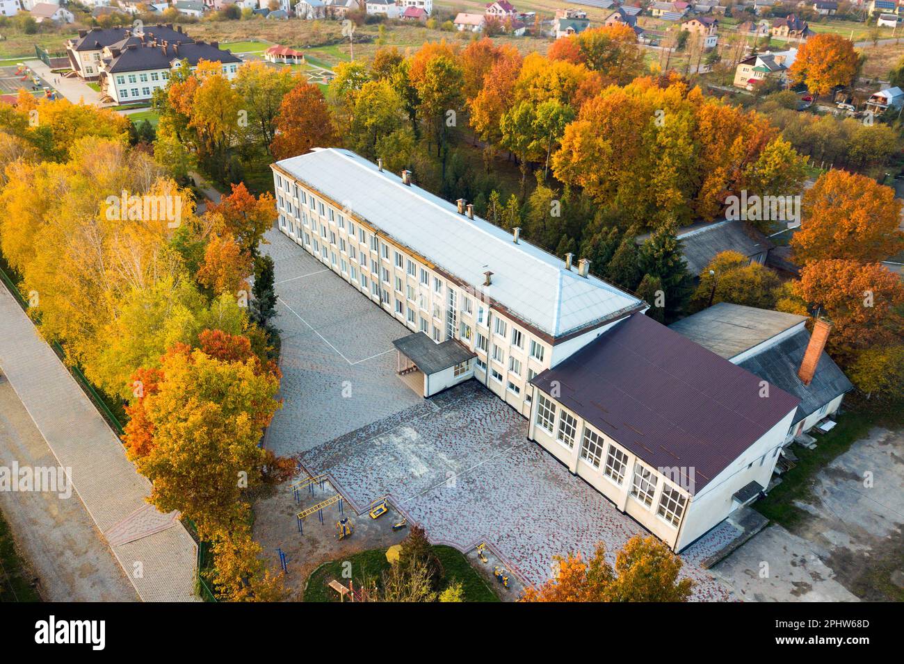Aerial view of school, college or kindergarten building with big yard ...