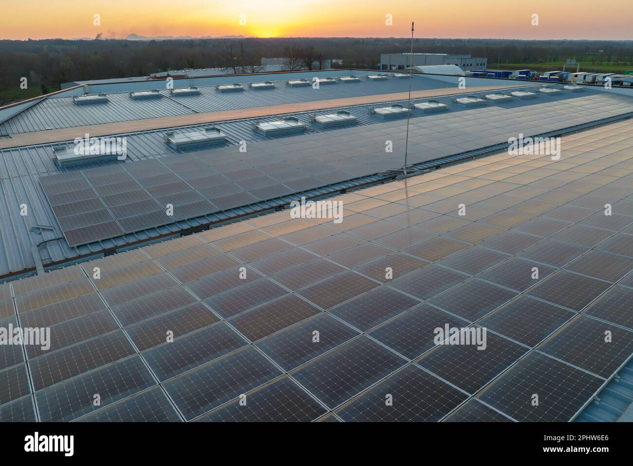 Aerial view of solar power plant with blue photovoltaic panels mounted ...