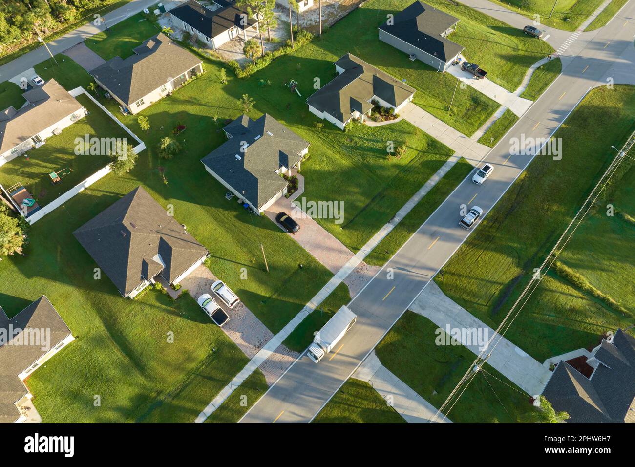 Aerial view of street traffic with driving cars in small town. American ...