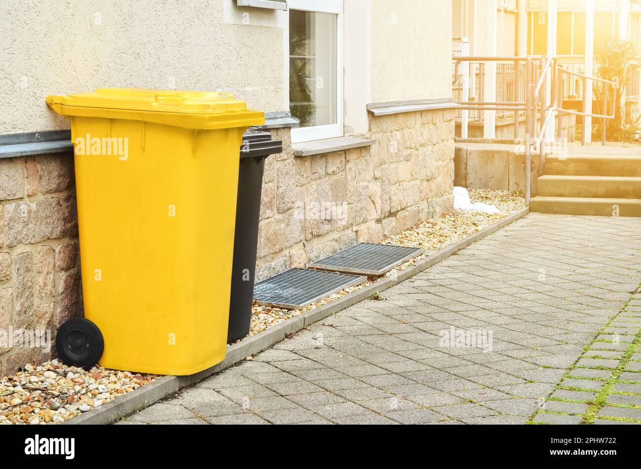 View of garbage containers in city Stock Photo - Alamy