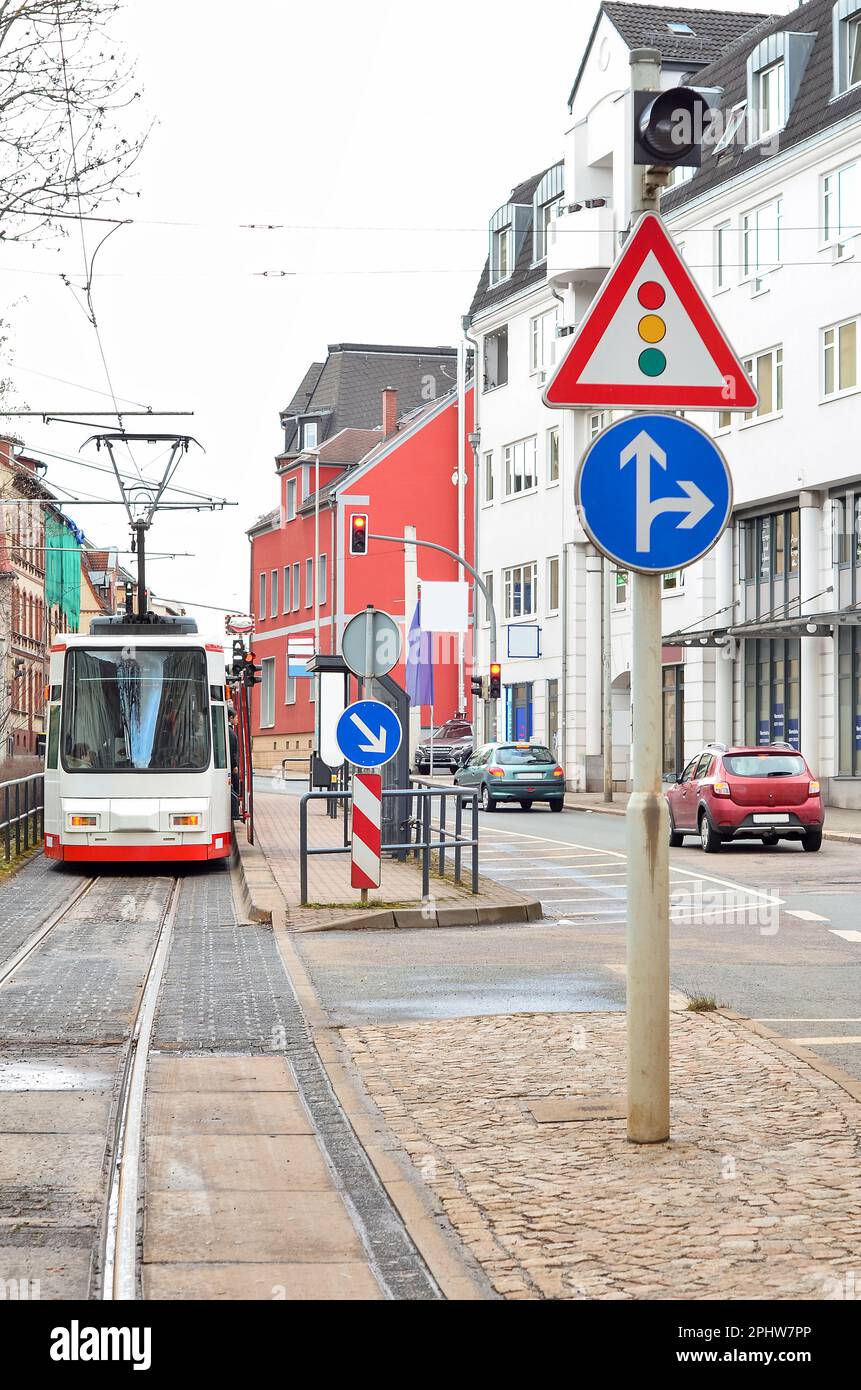 View of city street with tramway and road signs Stock Photo - Alamy
