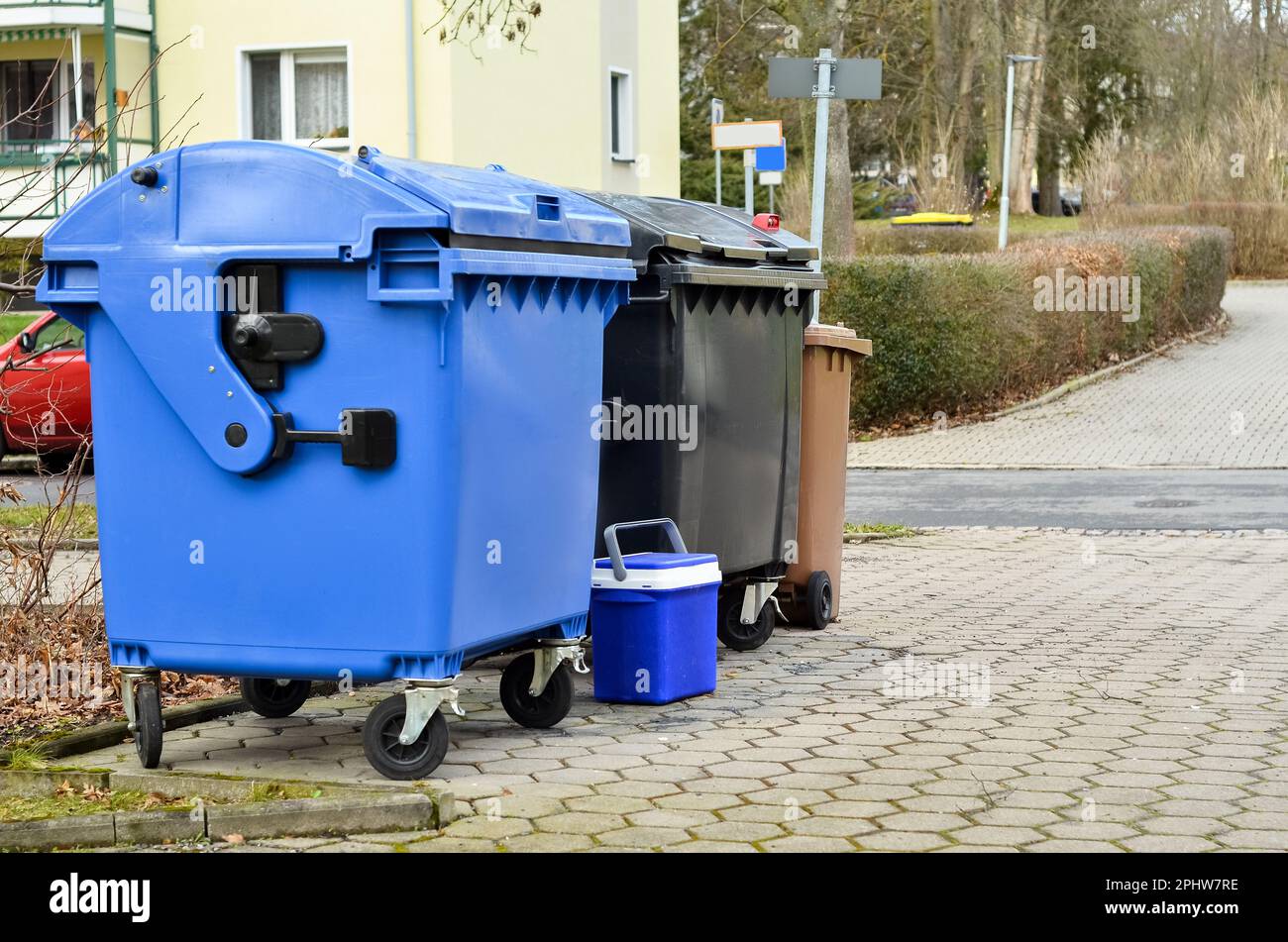 Garbage containers on city street Stock Photo - Alamy