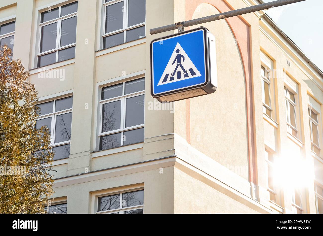 Pedestrian crossing sign in city Stock Photo - Alamy