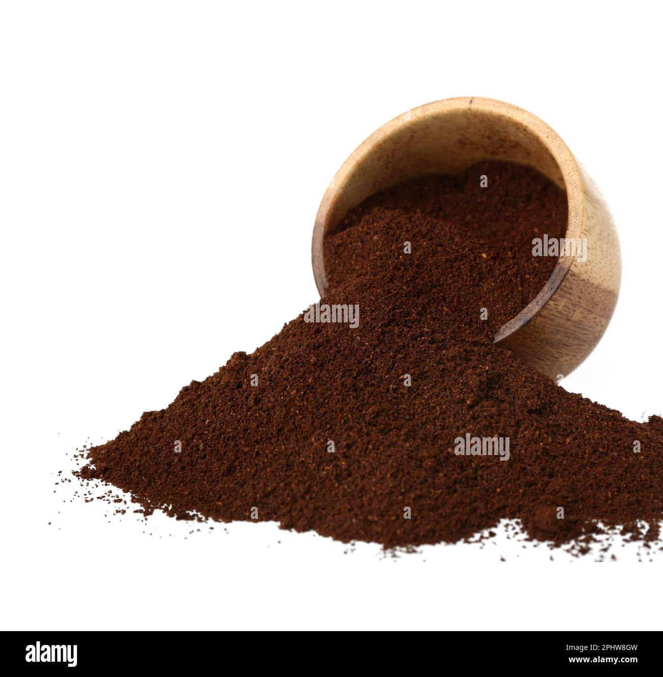 Overturned wooden bowl with coffee powder isolated on white background ...